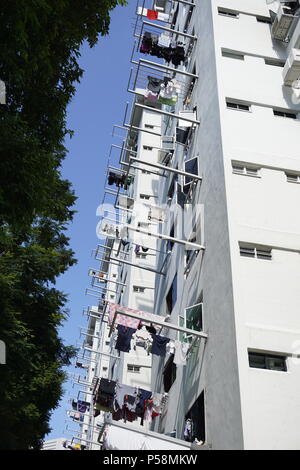 drying laundry hanging from poles at HDB flats in Singapore Stock Photo ...
