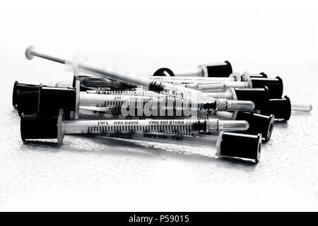 Close up of a bunch of unused syringes isolated on white Stock Photo ...