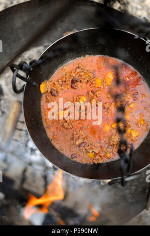 Chili con carne cooking over a barbeque Stock Photo - Alamy