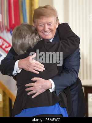 President Donald Trump hugs Pauline Connor, widow of 1st Lt. Garlin ...
