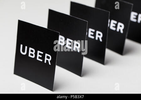 A photograph of the Uber logo. Uber is a popular taxi style transport ...
