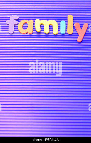 The word family in colorful letters on a green background Stock Photo ...