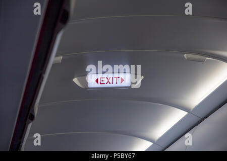 Emergency exit on an aircraft, view from inside of the plane. Empty ...