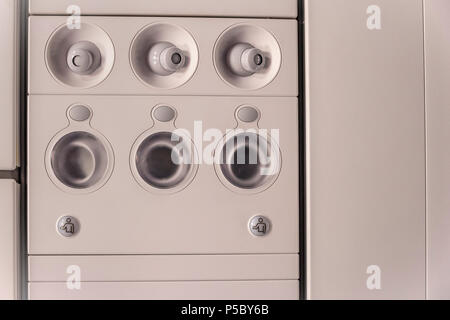 Overhead console in the modern passenger plane Stock Photo - Alamy