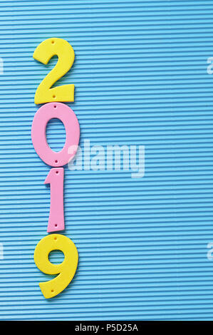 2019 in pink and yellow numbers on an orange background Stock Photo - Alamy