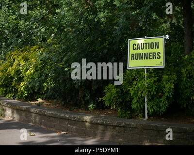 Caution runners sign Stock Photo - Alamy