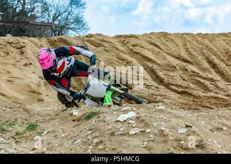 Close-up of accident in mountain bikes race in dirt track with flying ...