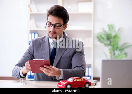 Agent offering car motor insurance Stock Photo - Alamy