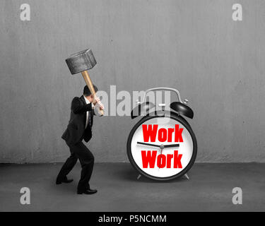 The businessman holding hammer and alarm clock isolated on white Stock ...