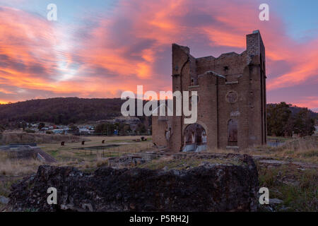 A sunrise over the iconic Lithgow Ironworks blast furnace in the blue ...