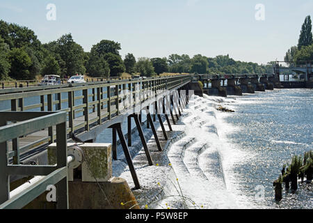 view across teddington lock weir, on the river thames in southwest ...