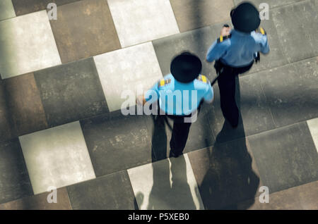 Two Policemen Patrolling the Area, Top View. Silhouettes of Two Police ...