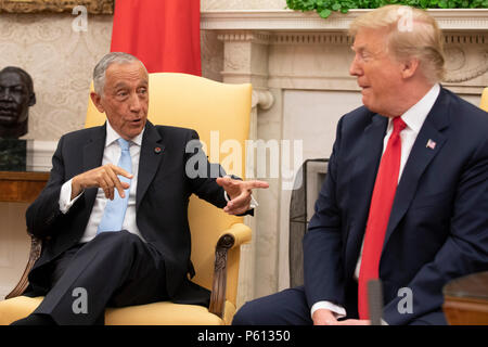 President Donald Trump listens as he meets with reporters to discuss ...