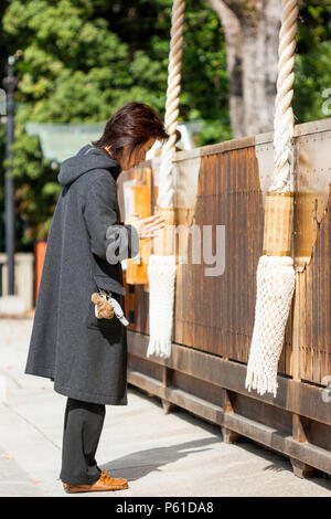 Rope of a Suzu, Japanese Shinto shrine bell with Offering written on it ...