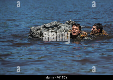 U.S. Army Soldier's swim with there equipment across Victory pond ...