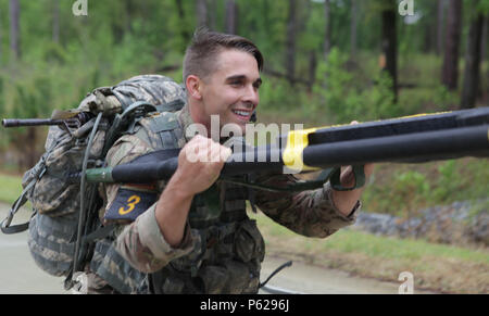 U.S. Army Capt. James Teskey assists his teammate 1st Lt. Nicholas ...