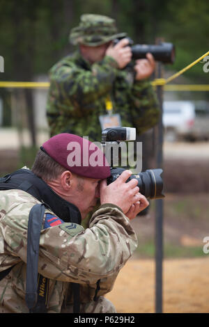 Canadian Combat Camera photographs a U.S. Army paratrooper at ...