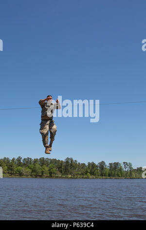 A U.S. Army Ranger jumps into Victory Pond during the Best Ranger ...