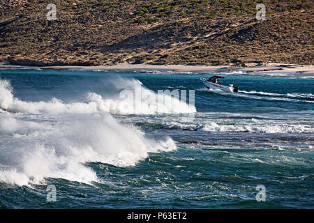 Small boat in rough seas at Trearddur Bay Stock Photo: 115913924 - Alamy