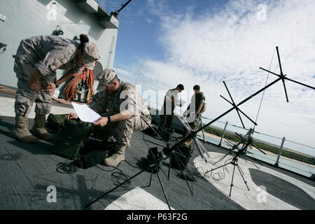 U.S. Marine Corps radio operators use communication gear during a Stock ...