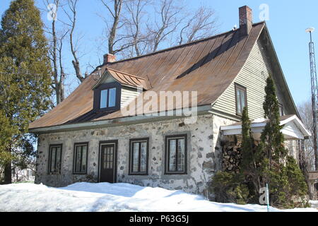 Exterior of cottage with dormer window above front door Stock Photo - Alamy