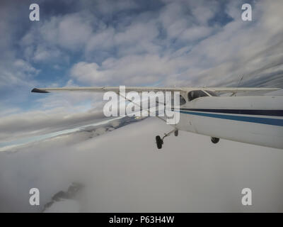 Airplane flying over the beautiful Canadian Landscape during a vibrant ...