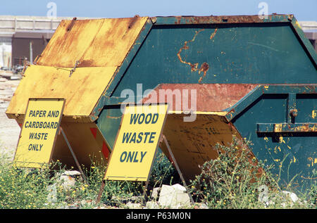 Waste skips on site with sorted types of waste Stock Photo - Alamy