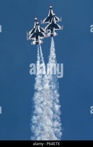 The Thunderbirds pilots perform the Diamond Clover-Loop Opener maneuver ...