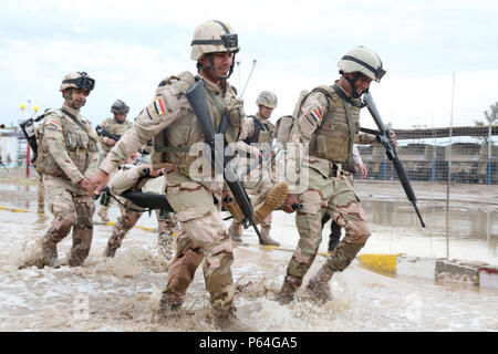 Iraqi soldiers of the 36th Brigade, 9th Iraqi Army, from a diamond ...