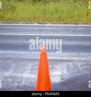Red Traffic Cone Side of the Street Stock Photo - Alamy