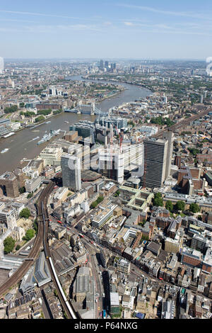 Wide aerial view River Thames low tide below A282 road bridge joining ...