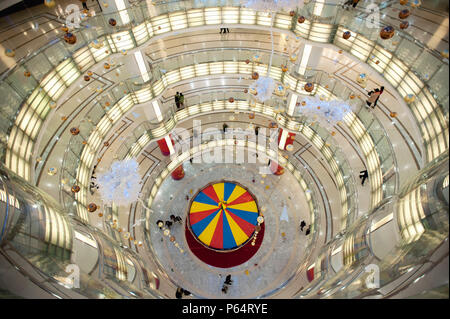 Interior view of spectacular circular atrium inside modern Joy City ...