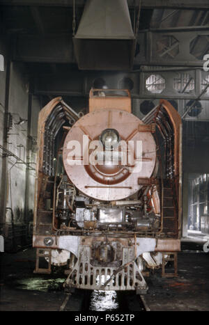 A China Railway's QJ Class 2-10-2 approaches Sankong Bridge. The vast ...