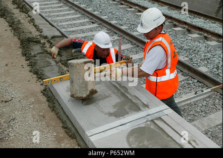 New platform coping stones being placed into position during the ...