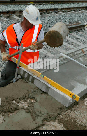 New platform coping stones being placed into position during the ...