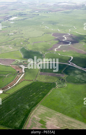 Cliffe Marshes in kent UK. A ship in background sailing up the River ...