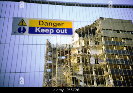 Safety fencing with danger demolition in progress sign in front of ...