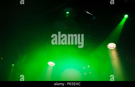 Green scenic lights, beams over dark background, modern stage ...