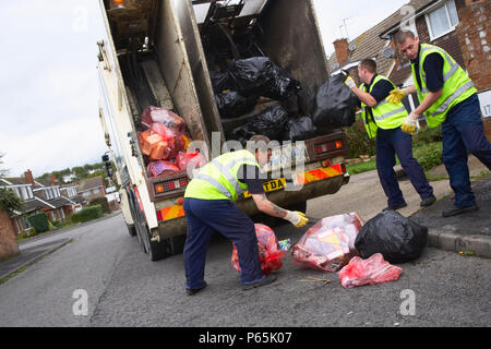 Binmen at work refuse collection Stock Photo - Alamy
