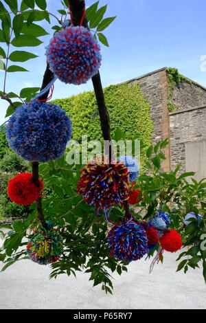 Baubles Made With Wool Pom-Poms on the tree Stock Photo - Alamy