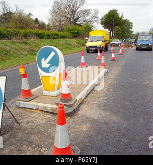Keep left bollard on traffic island in middle of road Stock Photo - Alamy