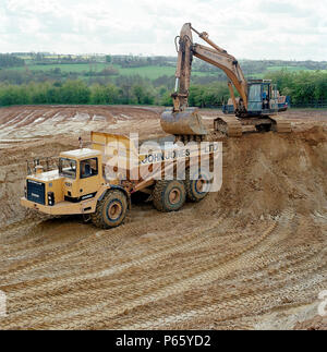 Caterpillar D400D articulated dumper truck and Komatsu crawler ...