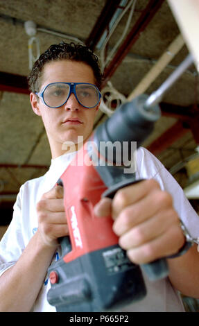 Man using a power drill Stock Photo - Alamy