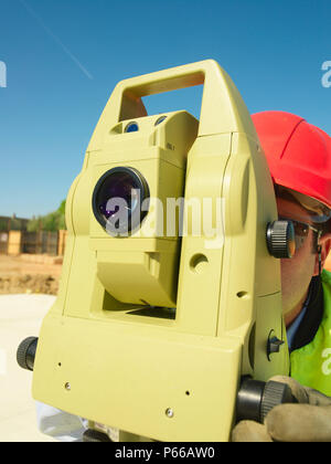 Man in sun hat using smartphone while sitting in outdoor cafe in the ...