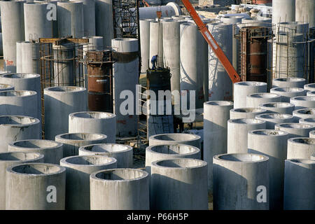 The drainage pipes at the large scale construction site against tower ...