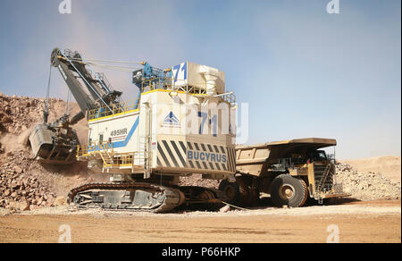 huge electric shovel loading copper ore into off road haul truck at ...