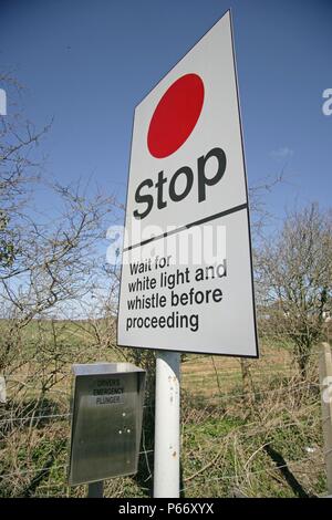 Emergency plunger sign on a rural rail crossing Stock Photo - Alamy
