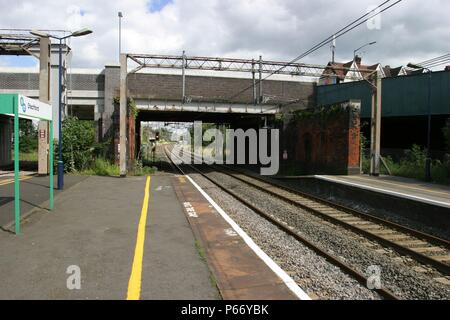 Platform end at Stechford station, West Midlands, showing vegitation ...