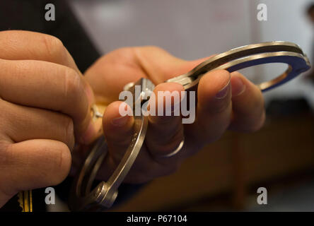 Corrections Officer in handcuffs Stock Photo - Alamy