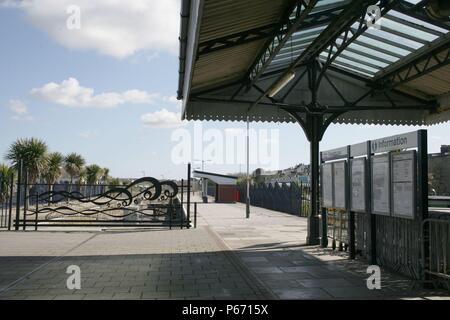 View along the platform at Newquay station, Cornwall, with decorated ...